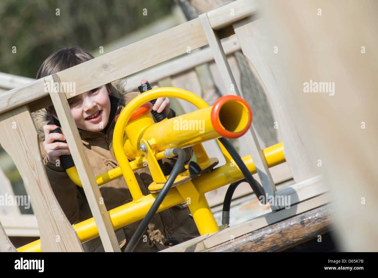 A small child playing with an air cannon at the Crealy adventure park ...