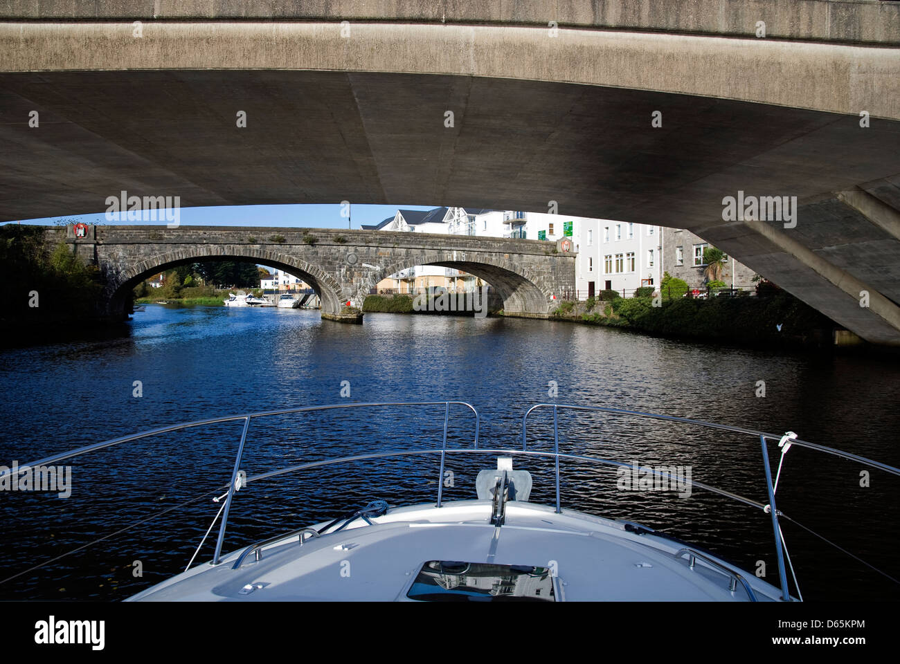 Boating under Enniskillen Bridges along River Erne, Lough Erne, County ...