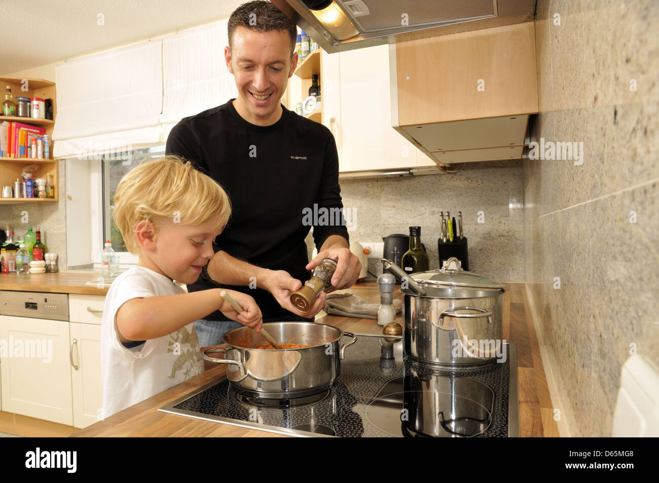 Child cooking pot hi-res stock photography and images - Alamy