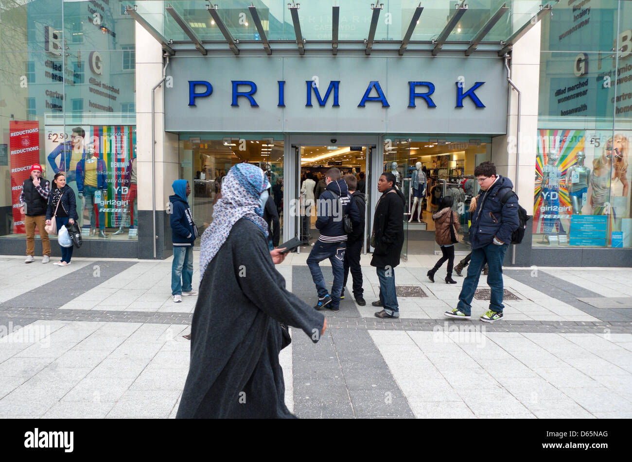 Muslim woman walking by Primark Cardiff Queen Street store Wales UK ...