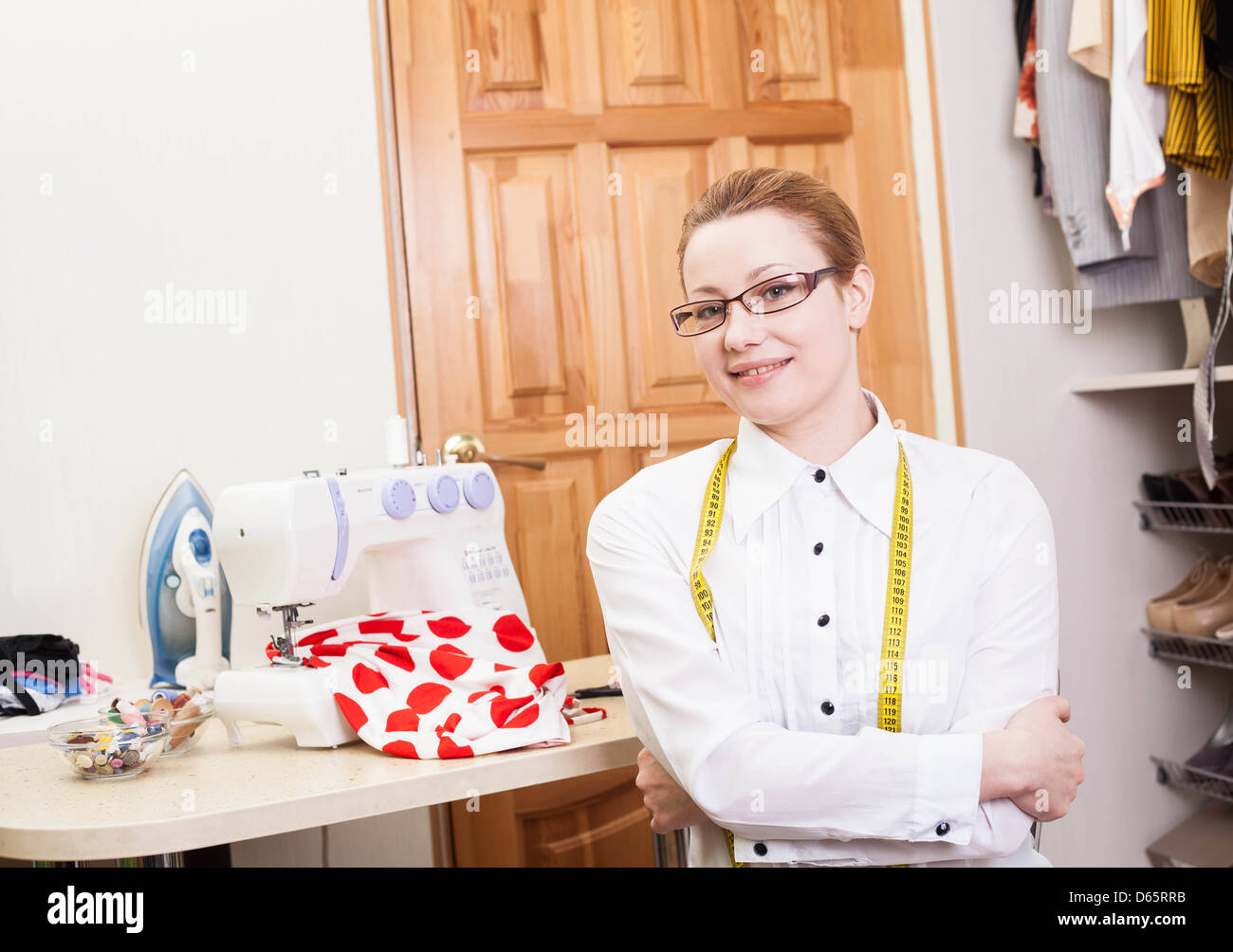 smiling dressmaker in a workroom Stock Photo - Alamy