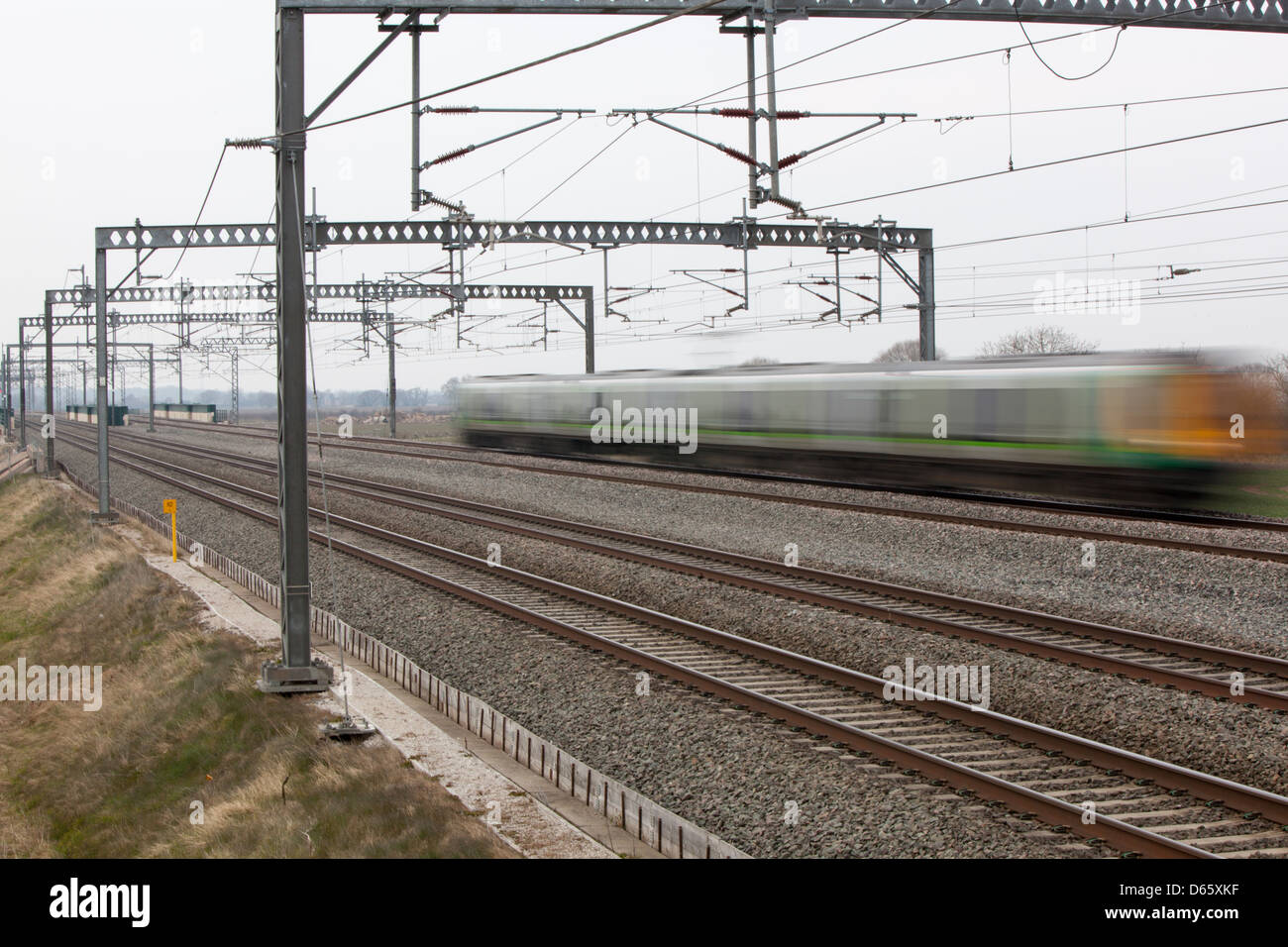 A London Midland train speeds along the West Coast Main Line railway ...