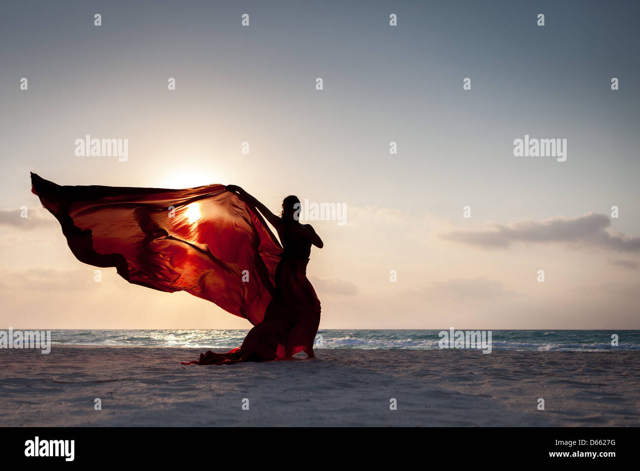 Woman holding scarf in the wind High Resolution Stock Photography and ...