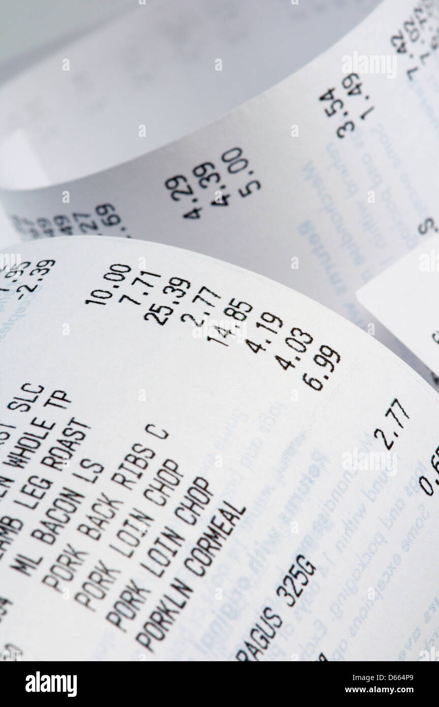 Grocery Receipts rolled up together Stock Photo - Alamy