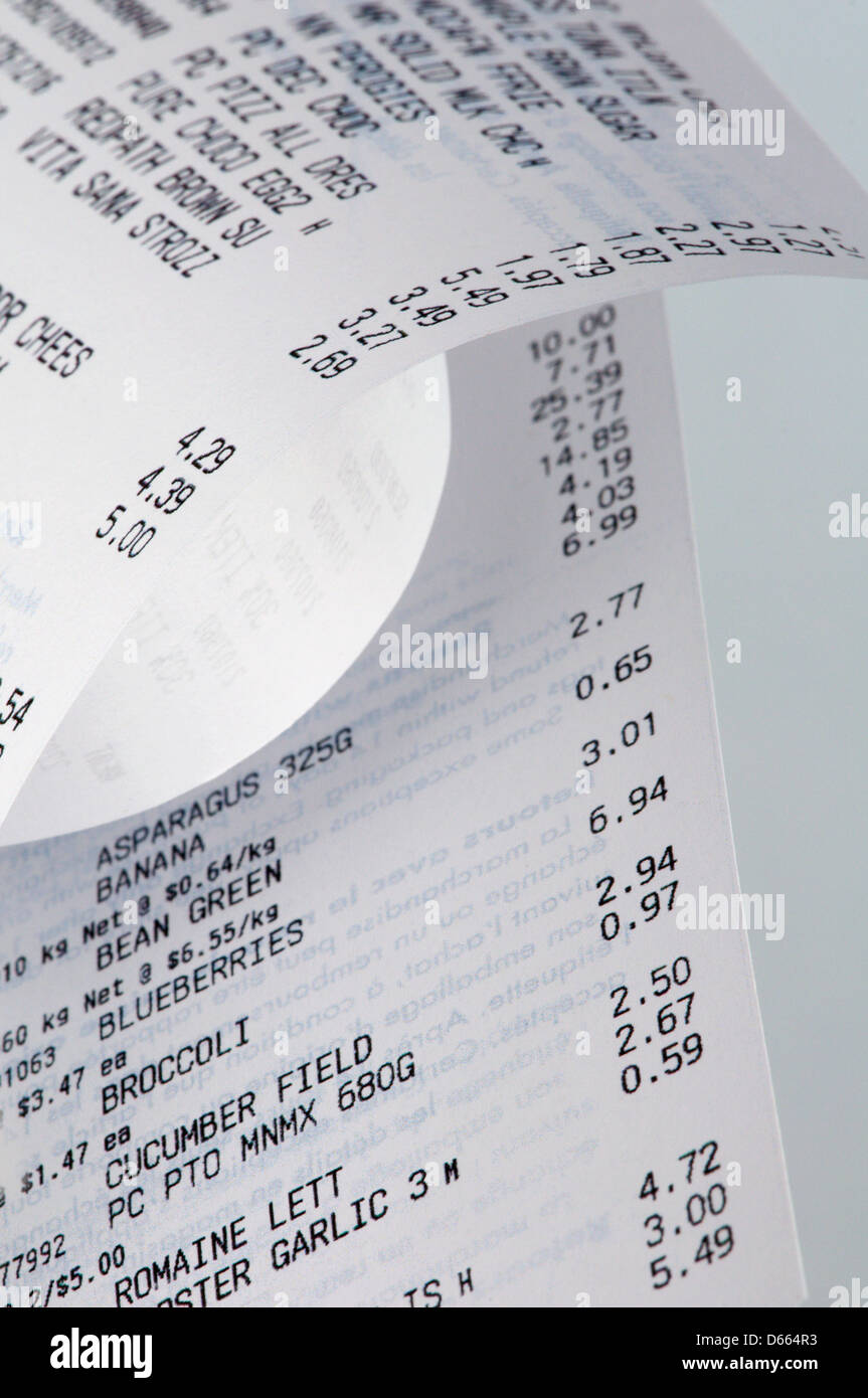 Grocery Receipts rolled up together Stock Photo - Alamy