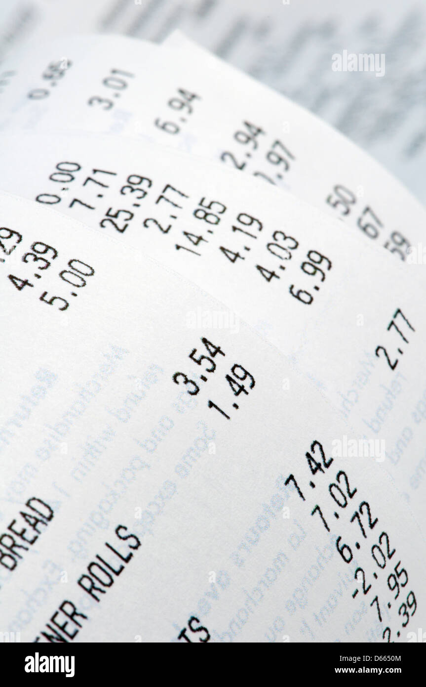 Grocery Receipts rolled up together Stock Photo - Alamy