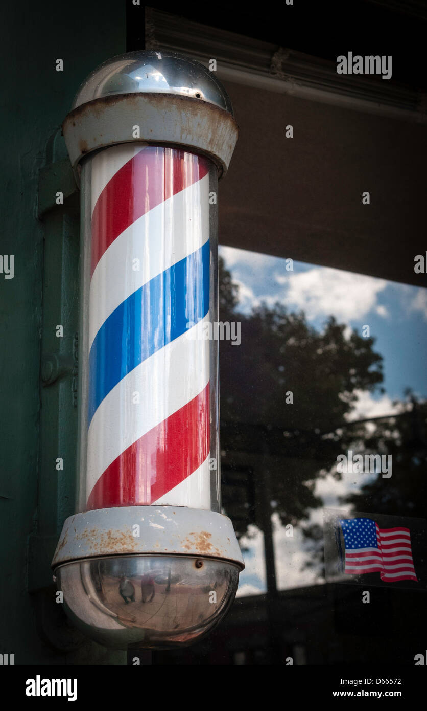 Iconic barber shop pole sign Stock Photo - Alamy