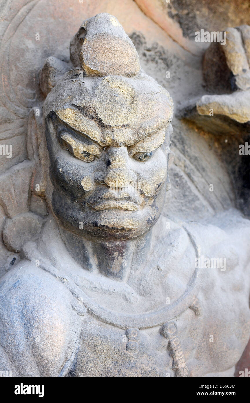 Ancient Buddha statue in caves in Guangyuan, Sichuan, China Stock Photo ...