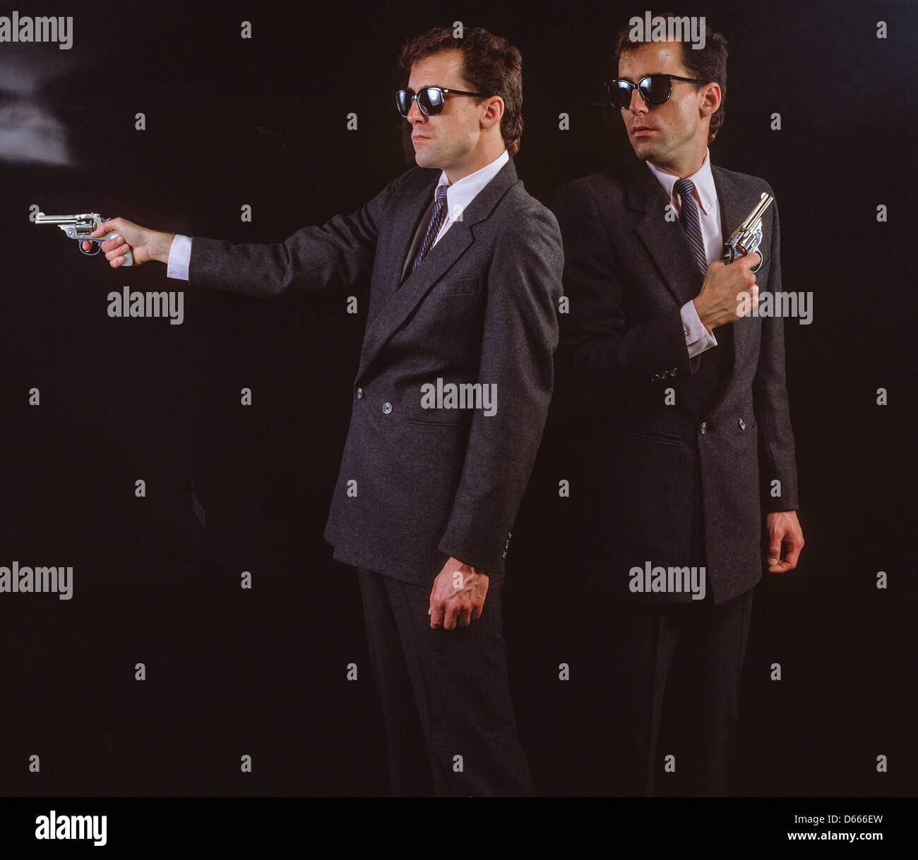 Man with handgun, pistol Stock Photo - Alamy