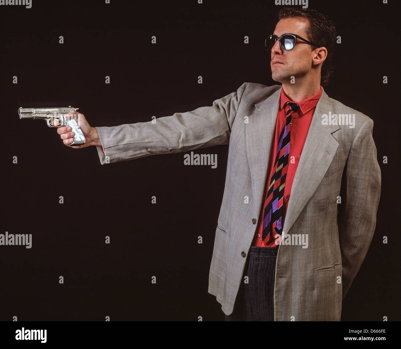 Man with handgun, pistol Stock Photo - Alamy