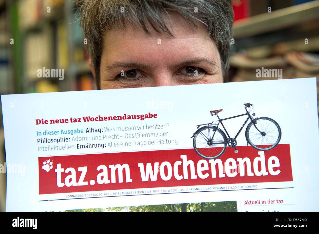 Editor-in-chief of daily newspaper taz, Ines Pohl, holds up the front ...