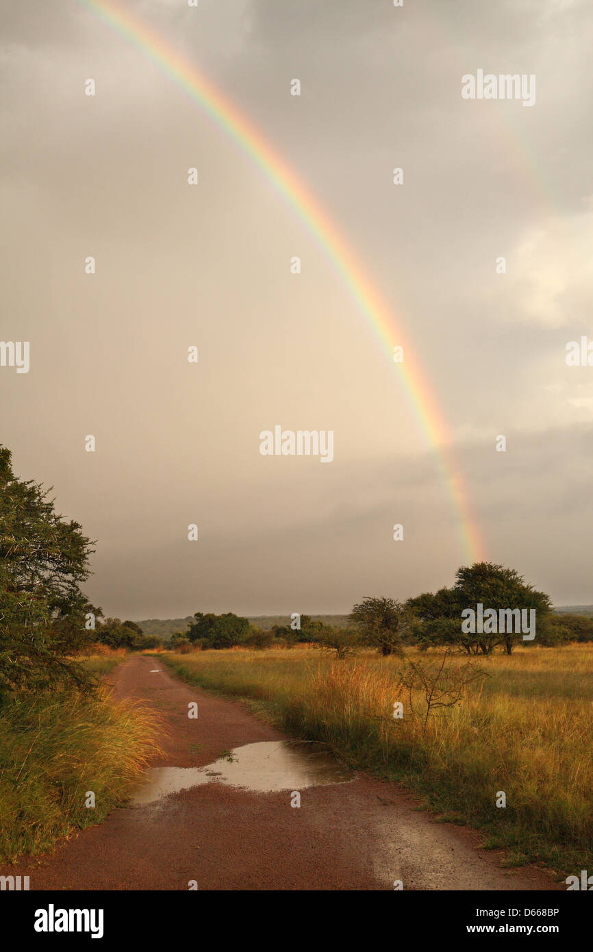 Rainbow over dirt road hi-res stock photography and images - Alamy