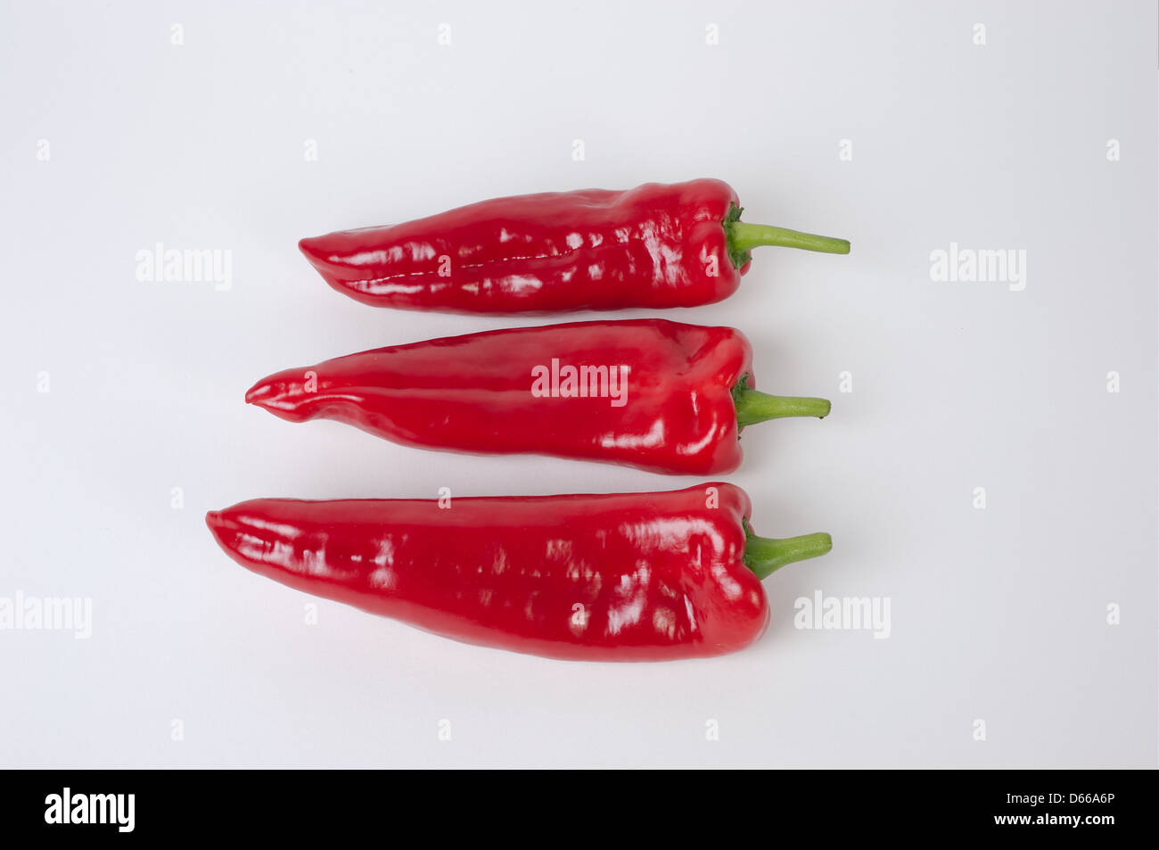 Three red chillis - Top View Stock Photo - Alamy