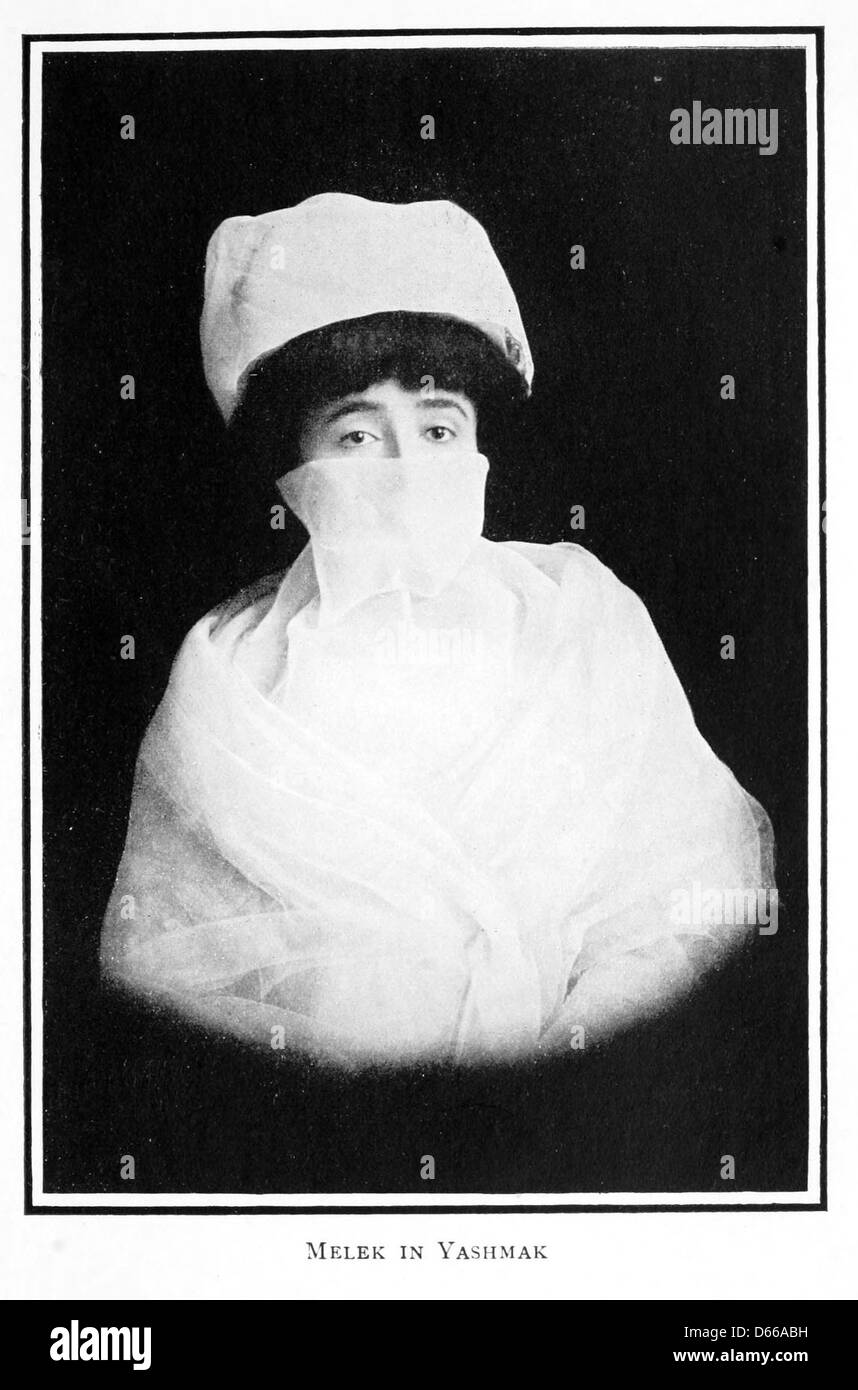 This 1913 photograph shows a Turkish woman wearing a yashmak, a ...