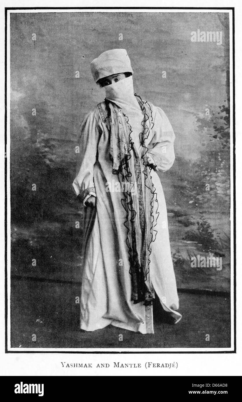 A 1913 photograph capturing a Turkish woman wearing a yashmak, a ...