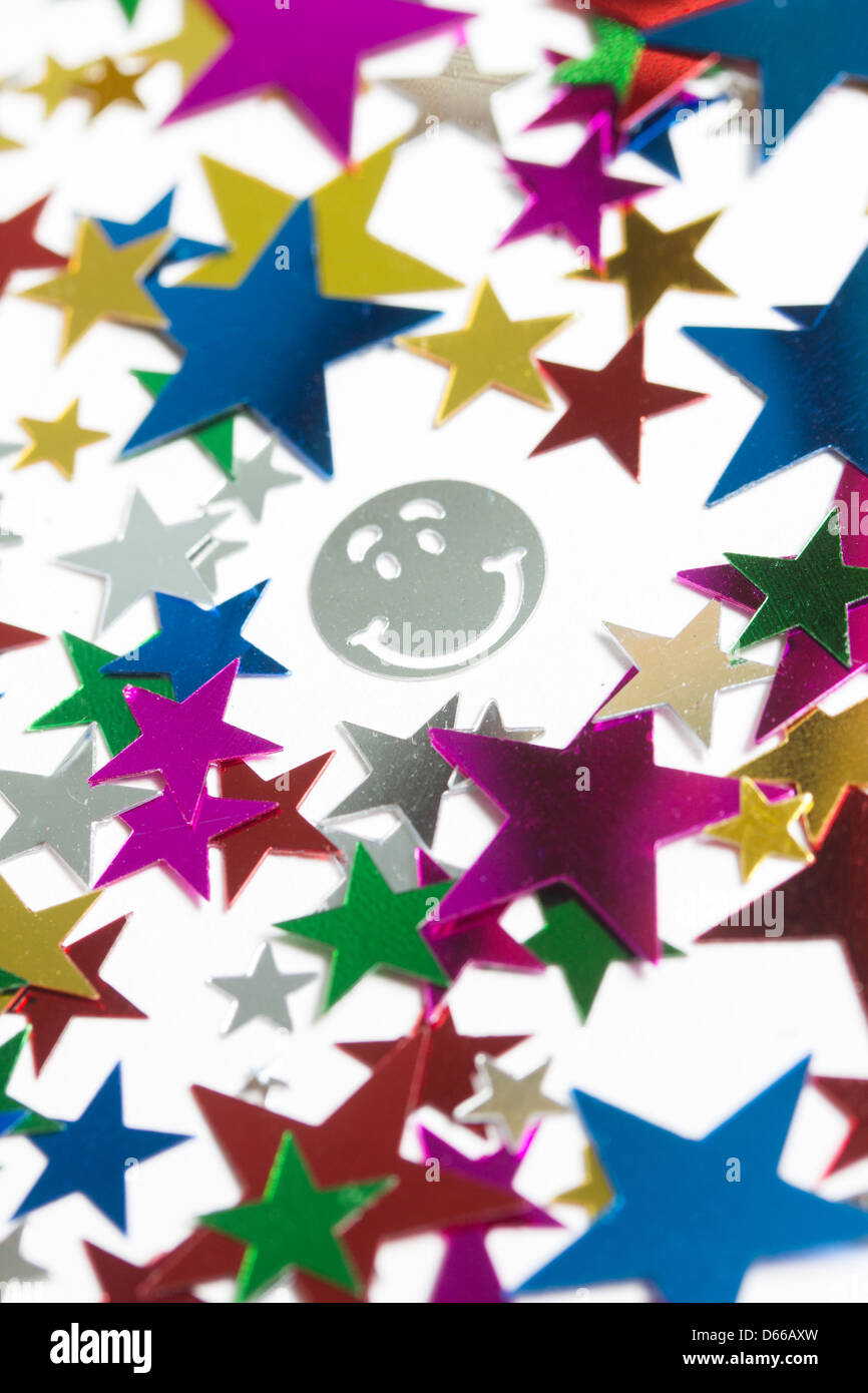 a colored shiny stars background with smiley face Stock Photo - Alamy