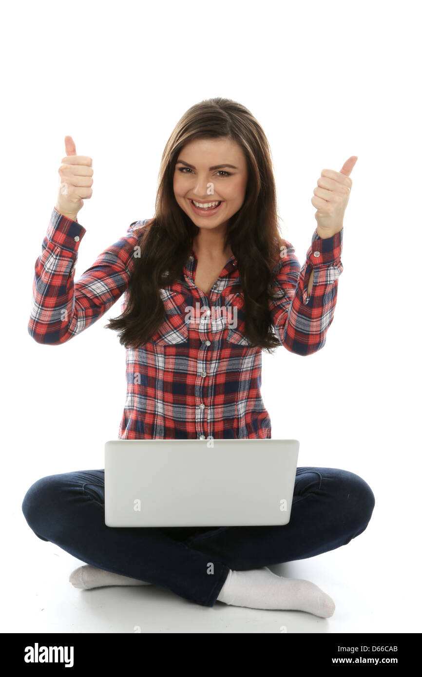 Young Woman Sitting On The Floor Alone Using A Laptop Computer, Working ...