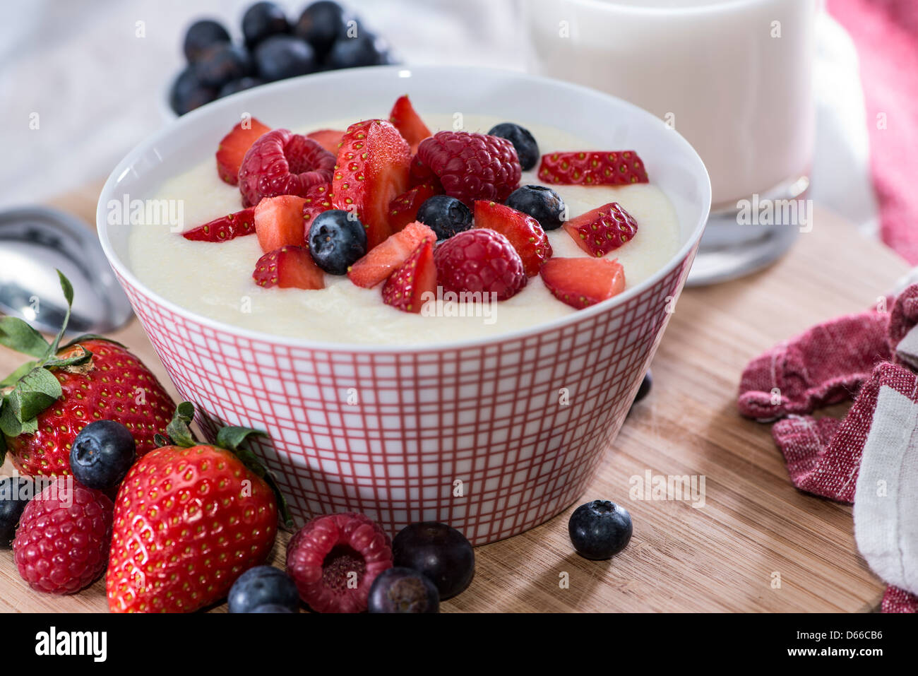 Portion of Semolina Pudding with fresh berries Stock Photo - Alamy