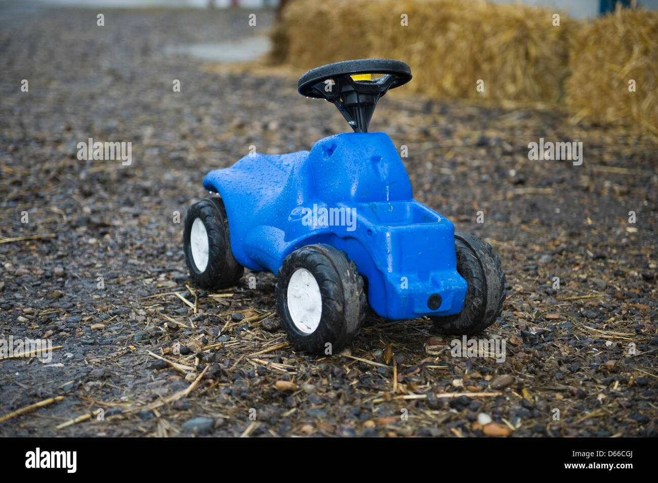 Blue toy tractor Stock Photo - Alamy
