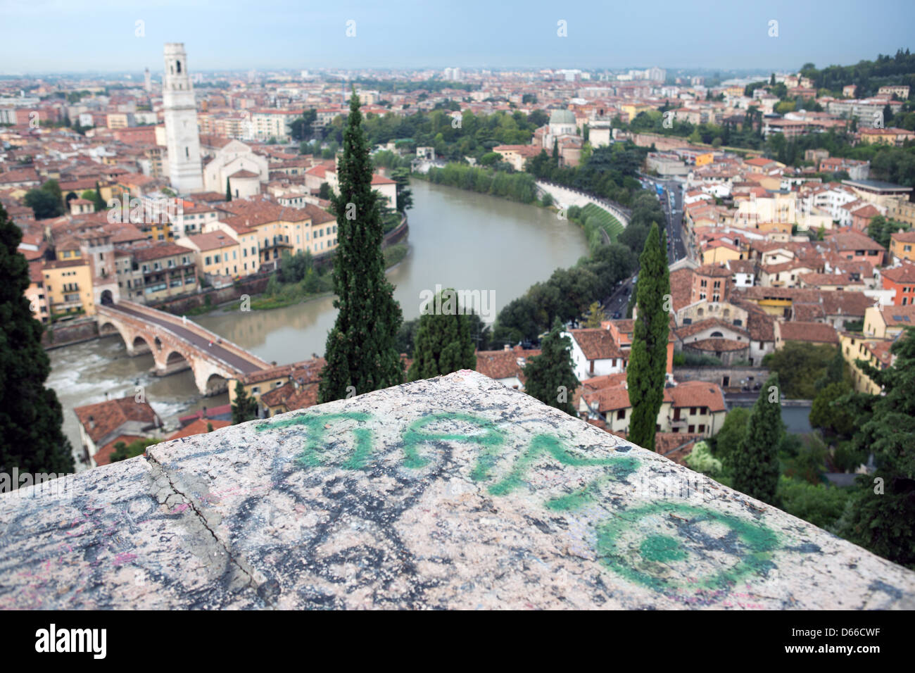 Panoramic view the old city Verona, Italy. Writing on the wall says ...