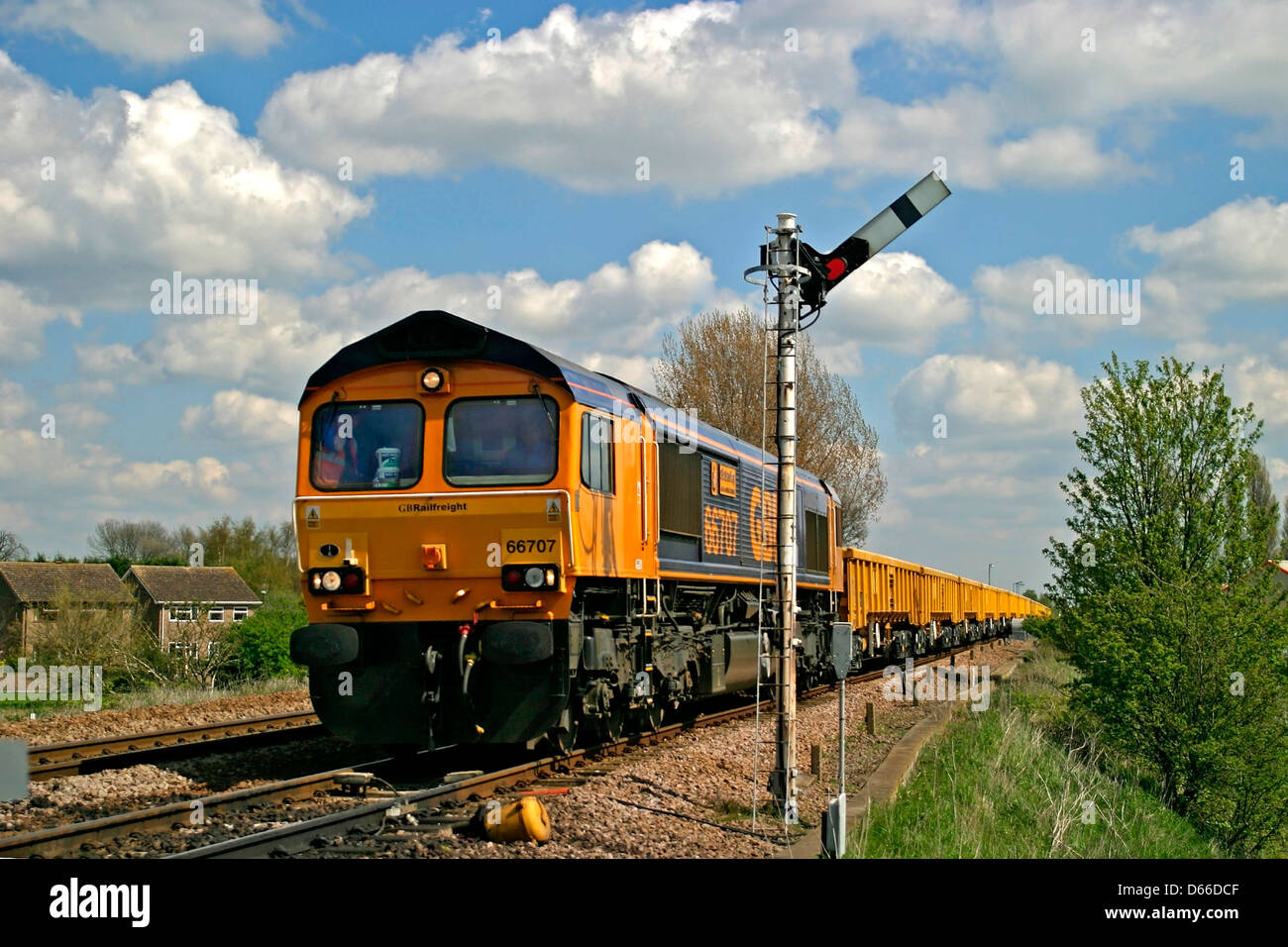 GBRF 66707 with a line of Networkrail wagons, at Whittlesey ...