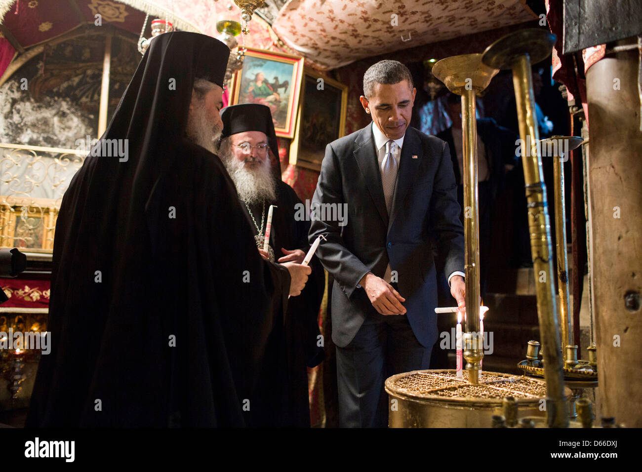 US President Barack Obama lights candles as he tours the crypt believe ...