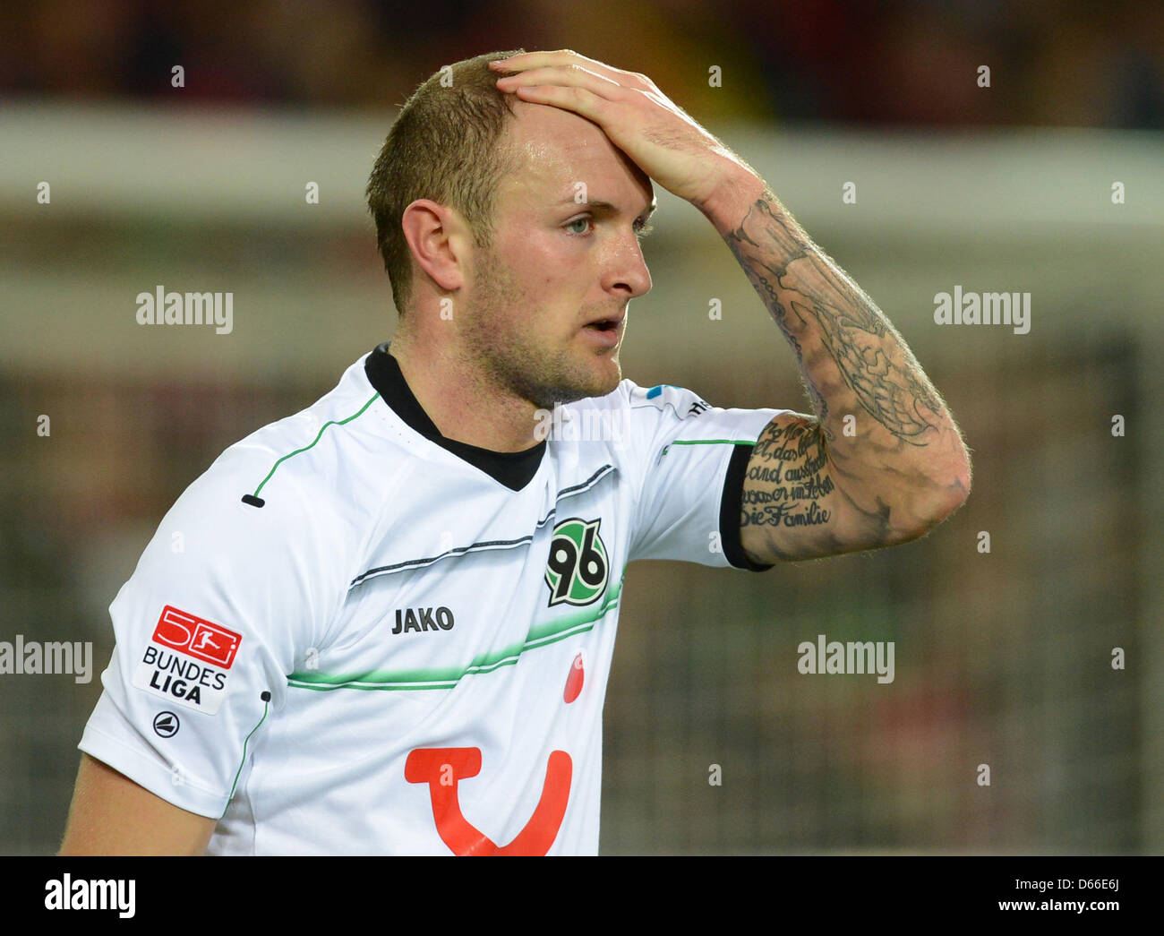 Hanover's Konstantin Rausch grabs his head during the German Bundesliga ...