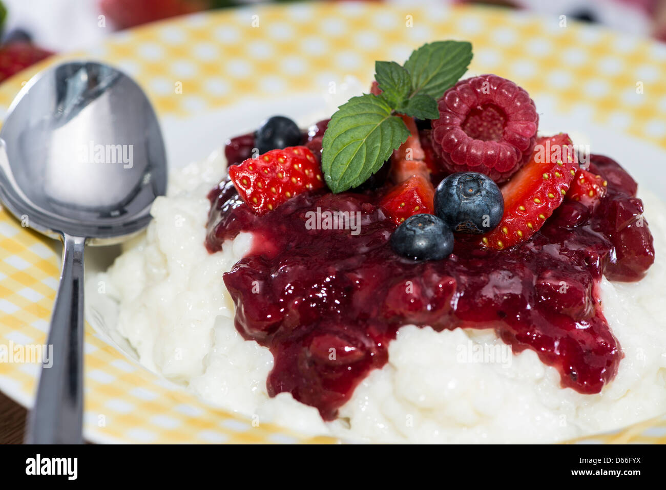 Rice Pudding with fruit sauce and mixed fresh fruits Stock Photo - Alamy