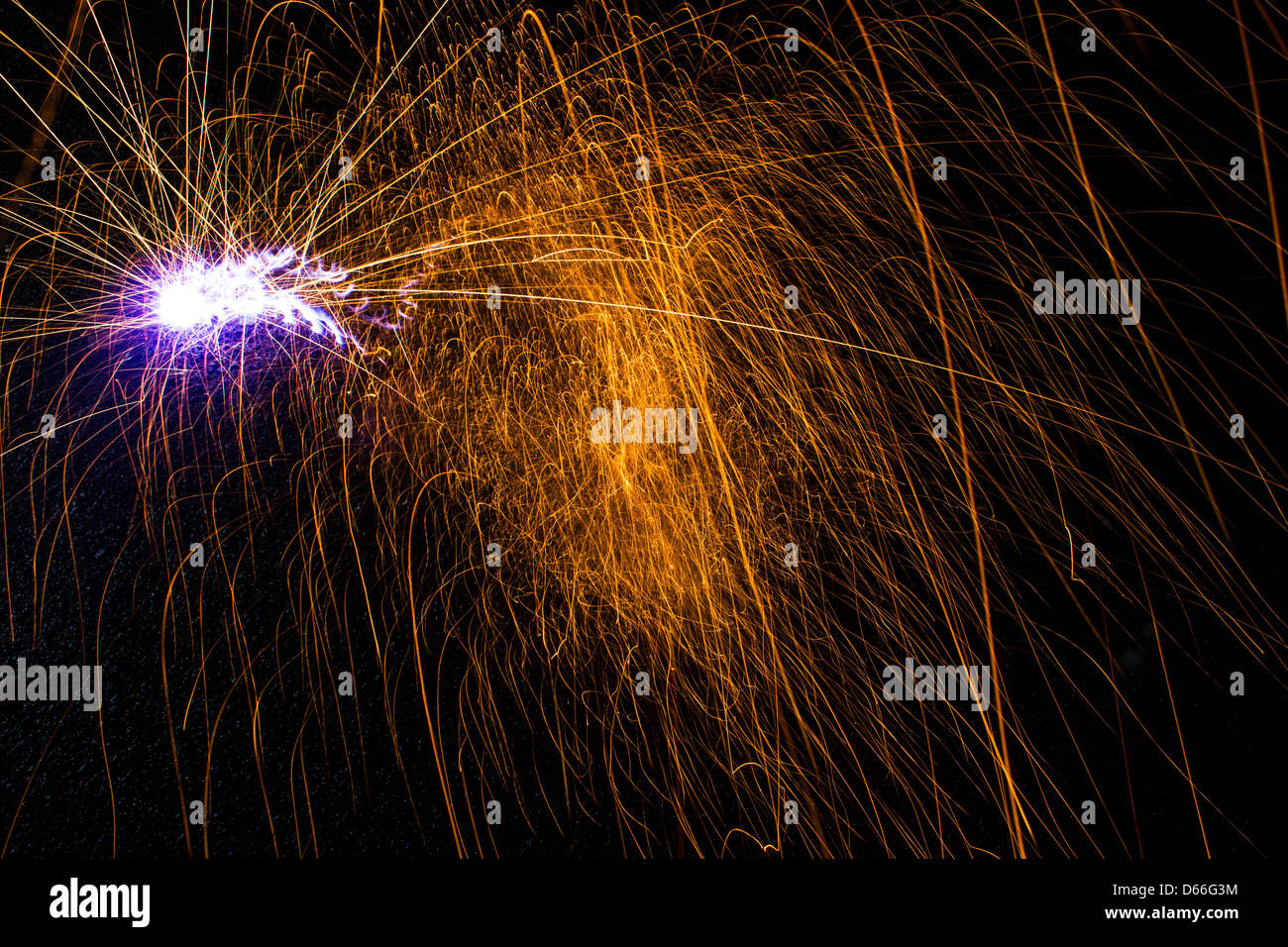 a little bright firework on the ground Stock Photo - Alamy