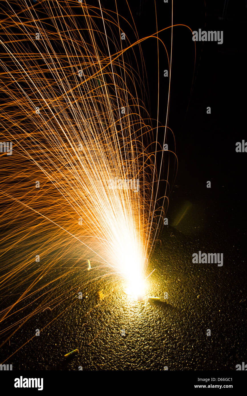 a little bright firework on the ground Stock Photo - Alamy