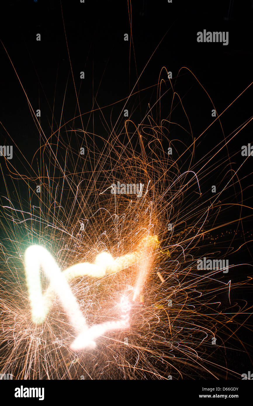 a little bright firework on the ground Stock Photo - Alamy