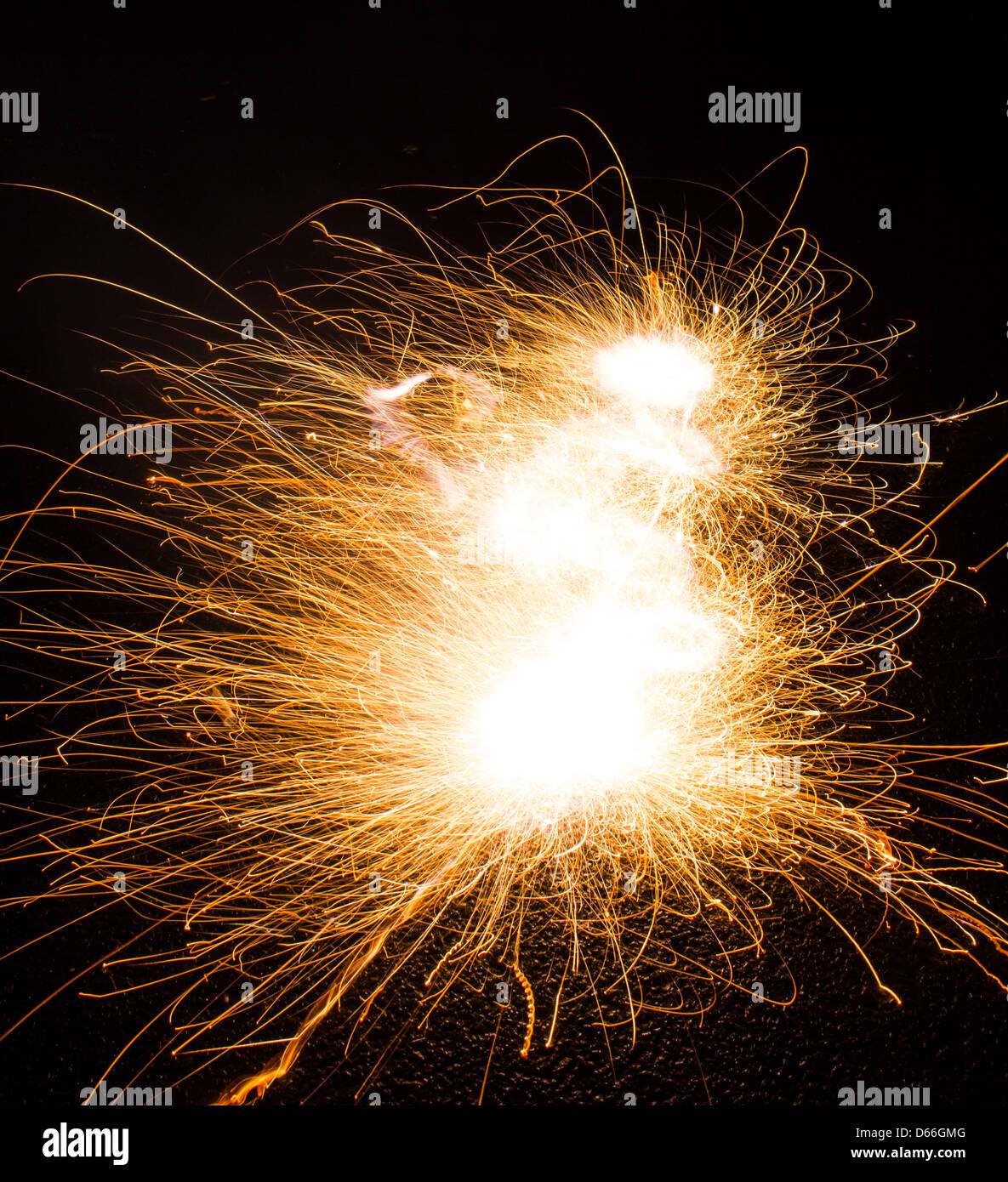 a little bright firework on the ground Stock Photo - Alamy