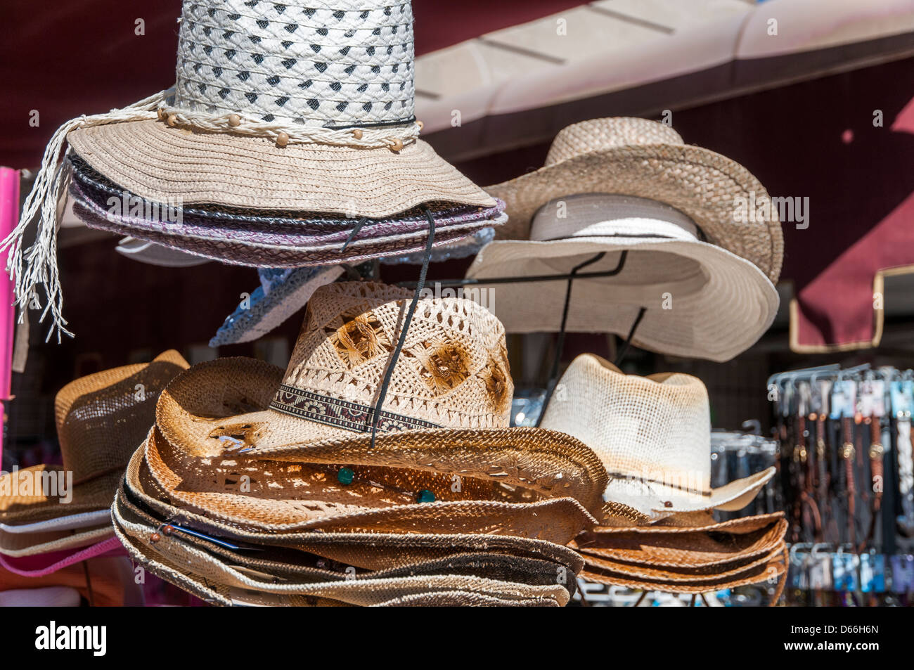 hats hanging on a rack to be viewed Stock Photo - Alamy