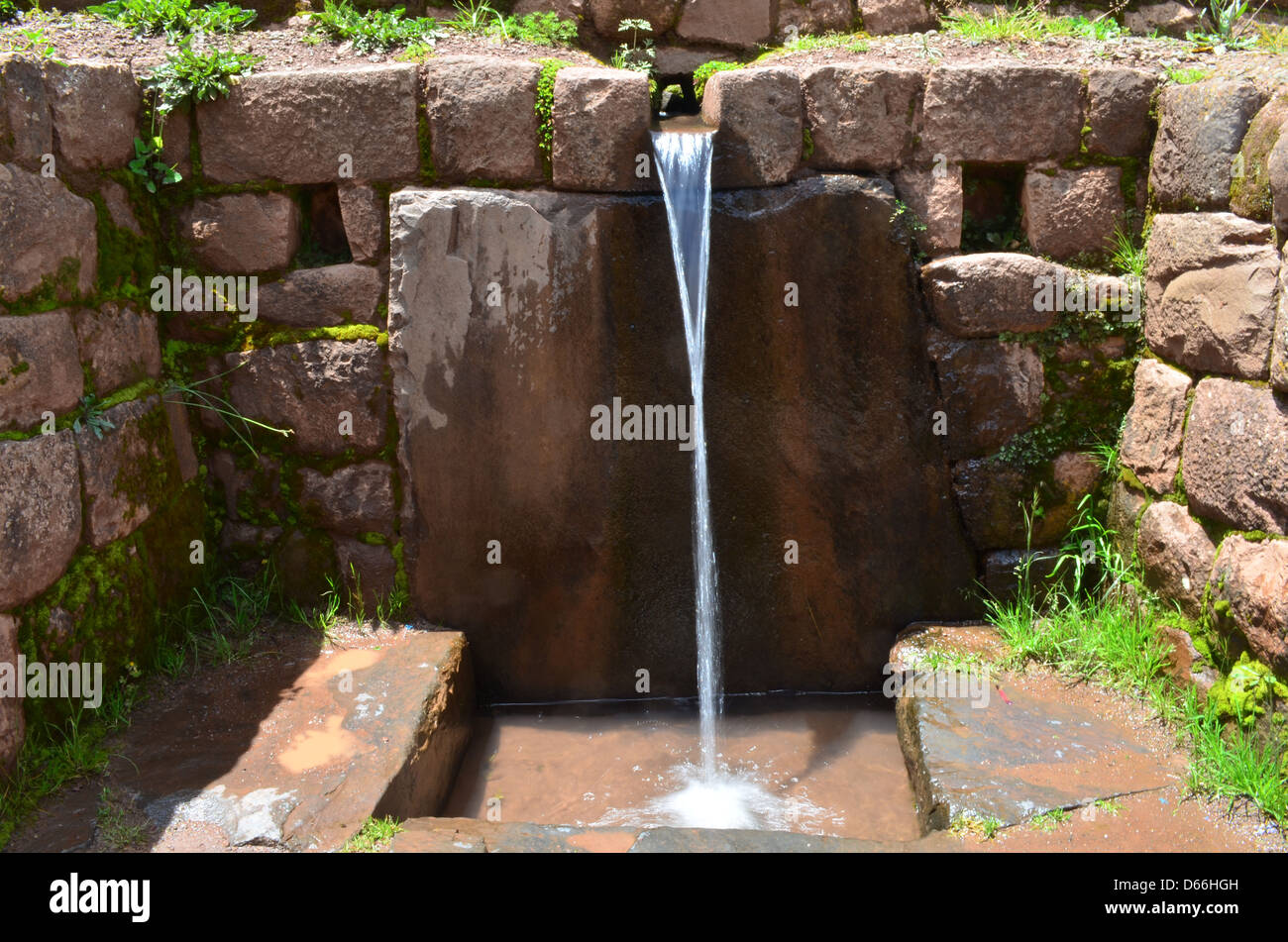 Inca stone water fountain in the ruins of Pisac, Peru Stock Photo - Alamy