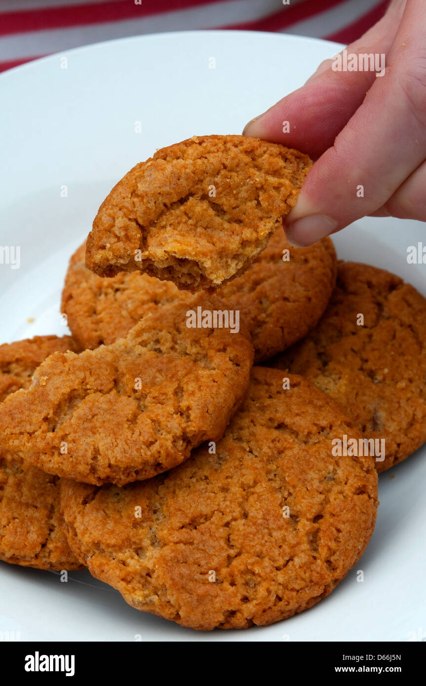 Snap biscuit hand hi-res stock photography and images - Alamy