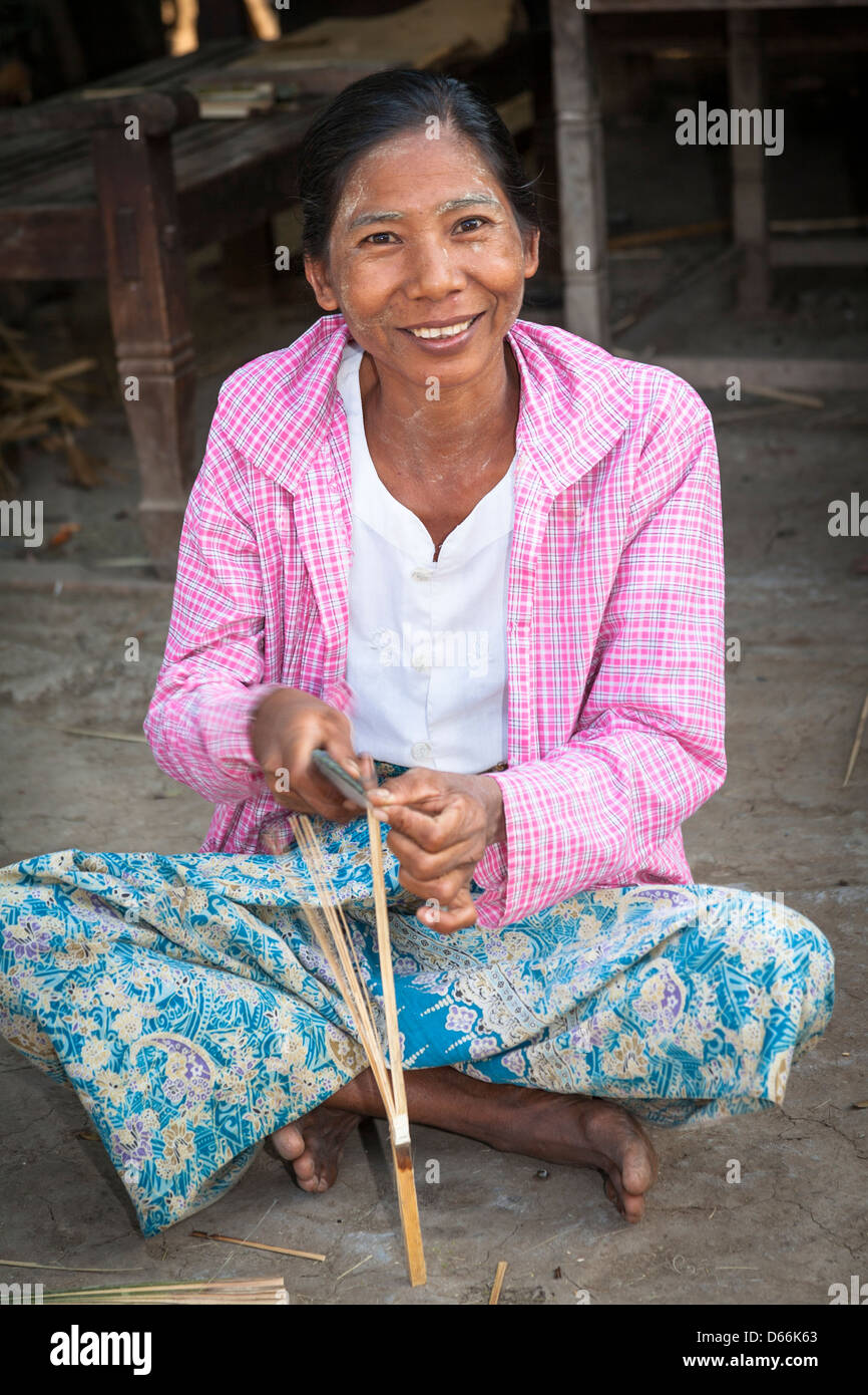 Woman splitting bamboo to make a fan, Yay Kyi village, Mandalay ...