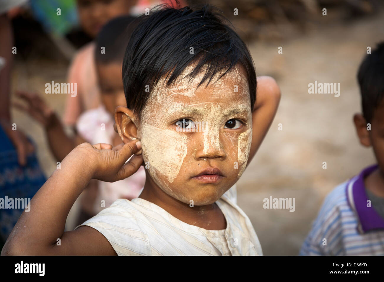 Young child wearing thanaka on his face, Yay Kyi village, Mandalay ...