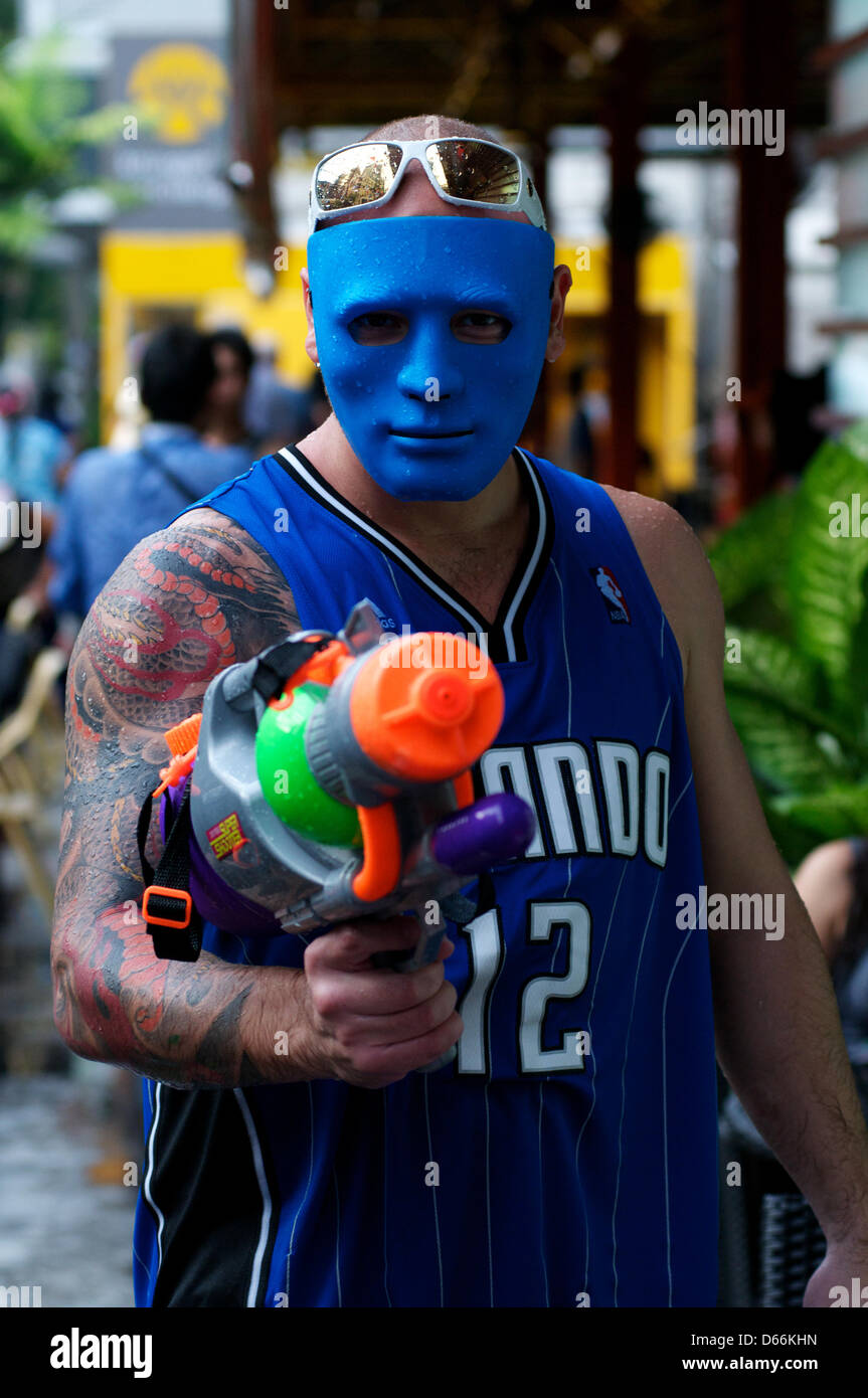Bangkok, Thailand, April 13th, 2013. a masked man & his gun. Bangkok ...