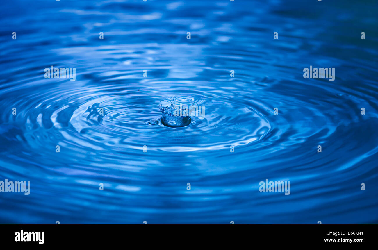 Closeup of water splash in blue tonality Stock Photo - Alamy