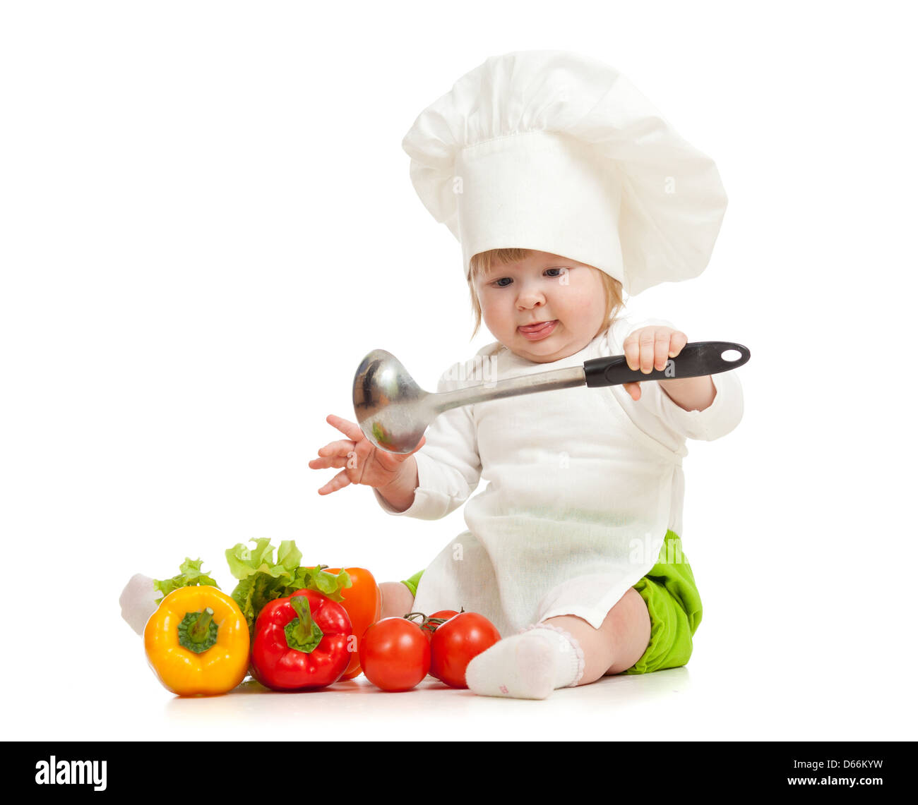 Kid in chef hat with healthy food vegetables Stock Photo - Alamy