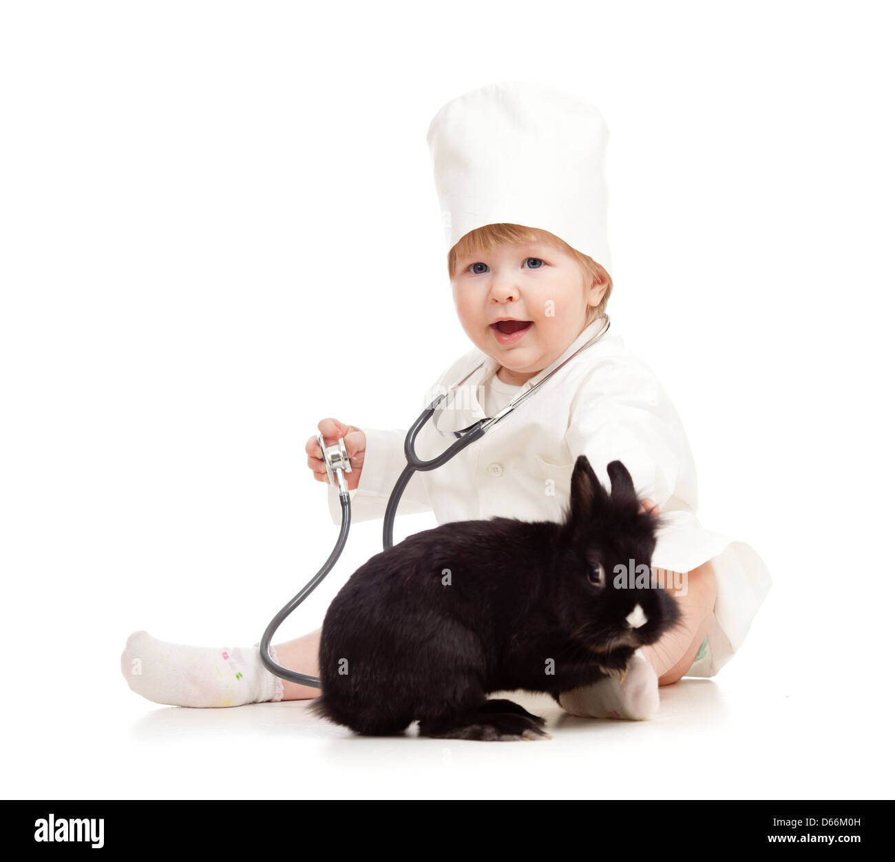 Adorable kid doctor with pet Stock Photo - Alamy