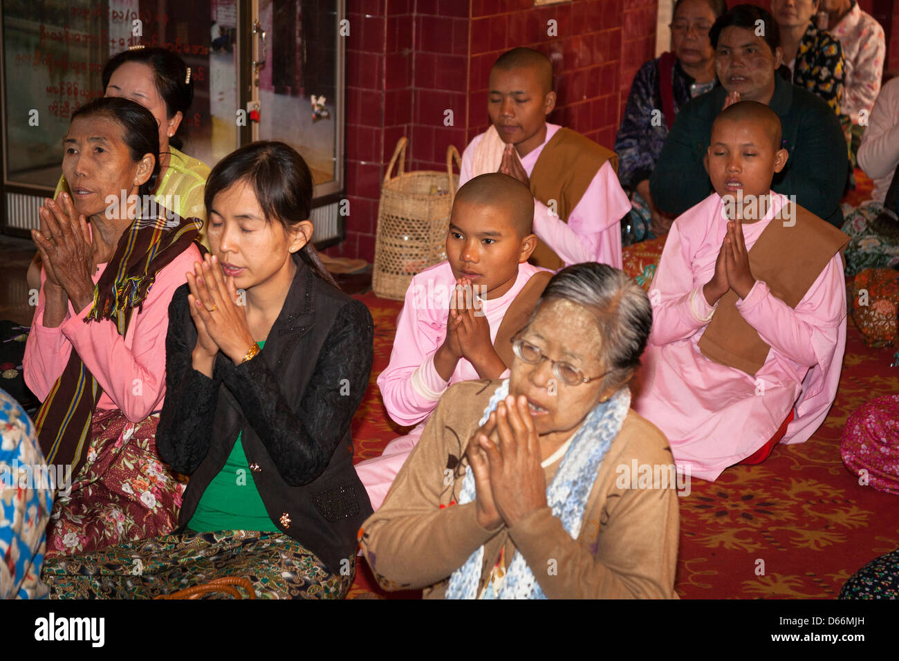 Buddhist nuns praying mahamuni mandalay hi-res stock photography and ...