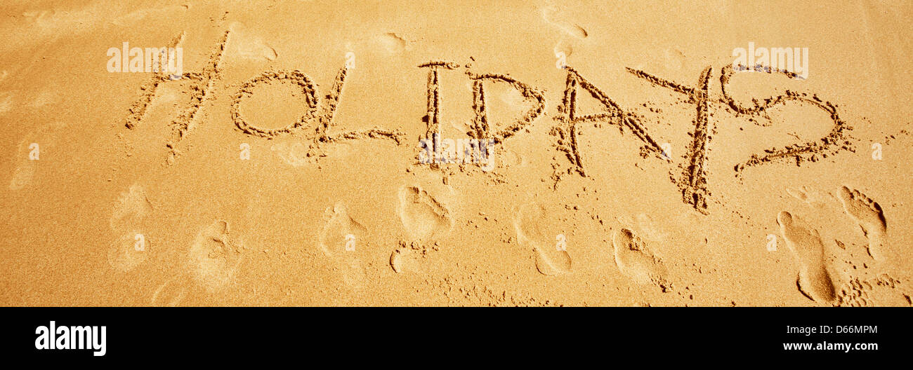 Messages and words written in the sand on a beach. Topical for travel ...
