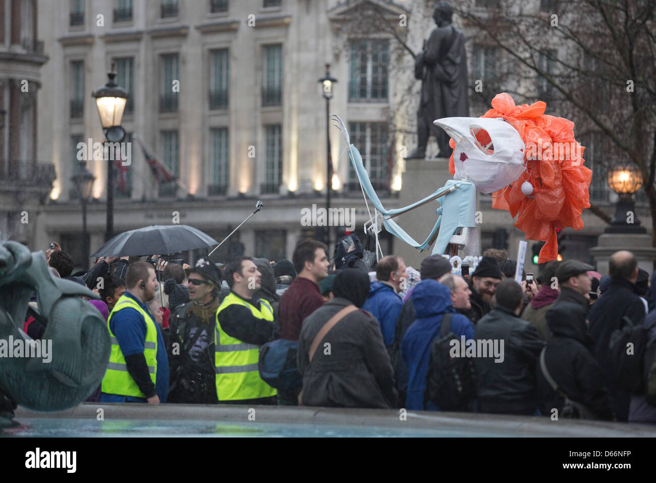 London, UK. Saturday, 13 April 2013. A large effigy is paraded around ...