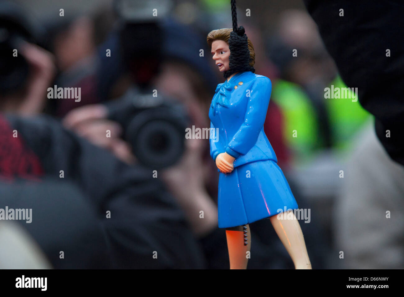 People taunt a plastic effigy of Margaret Thatcher hanging from a noose ...