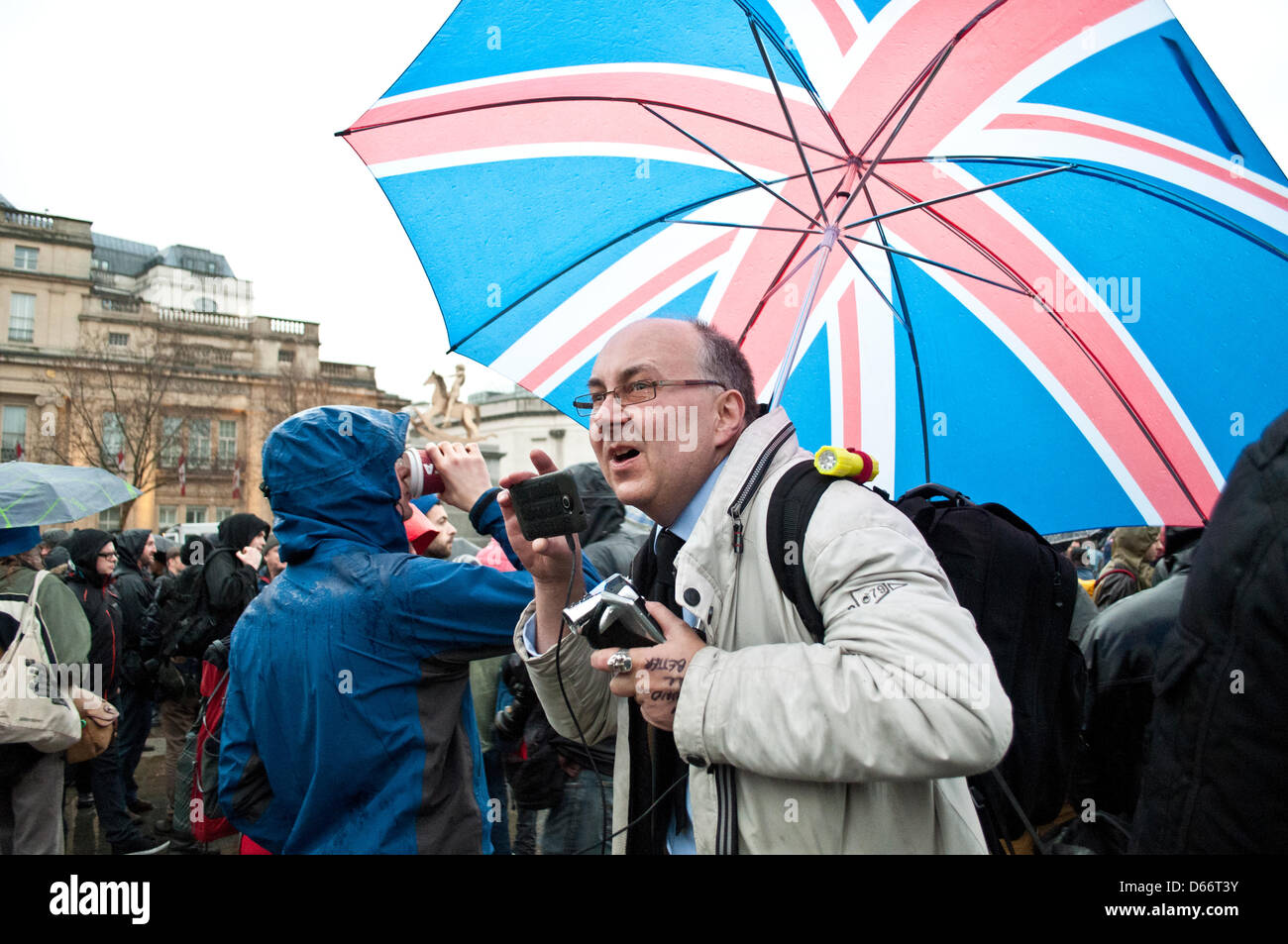 Man with Union Jack umbrella during the demonstration for the Death of ...