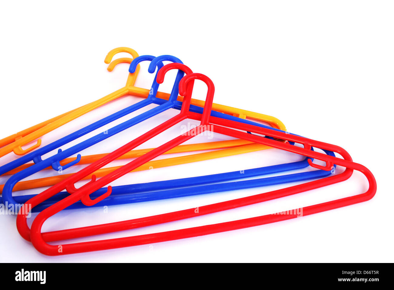 Colorful hangers isolated on white background Stock Photo - Alamy