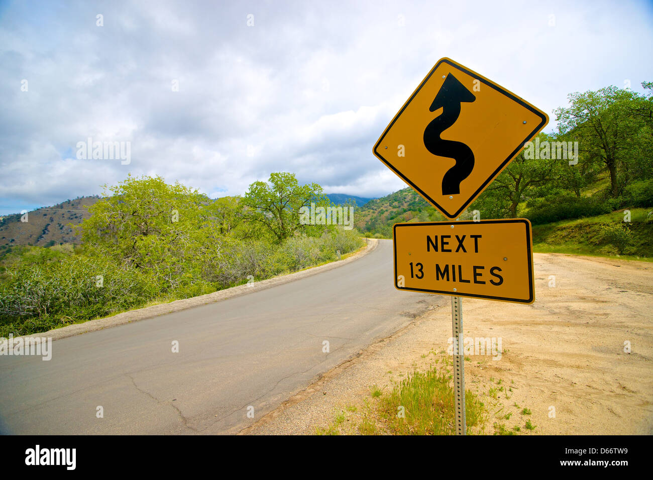 Winding road sign warns of dangerous roads for the next few miles Stock ...