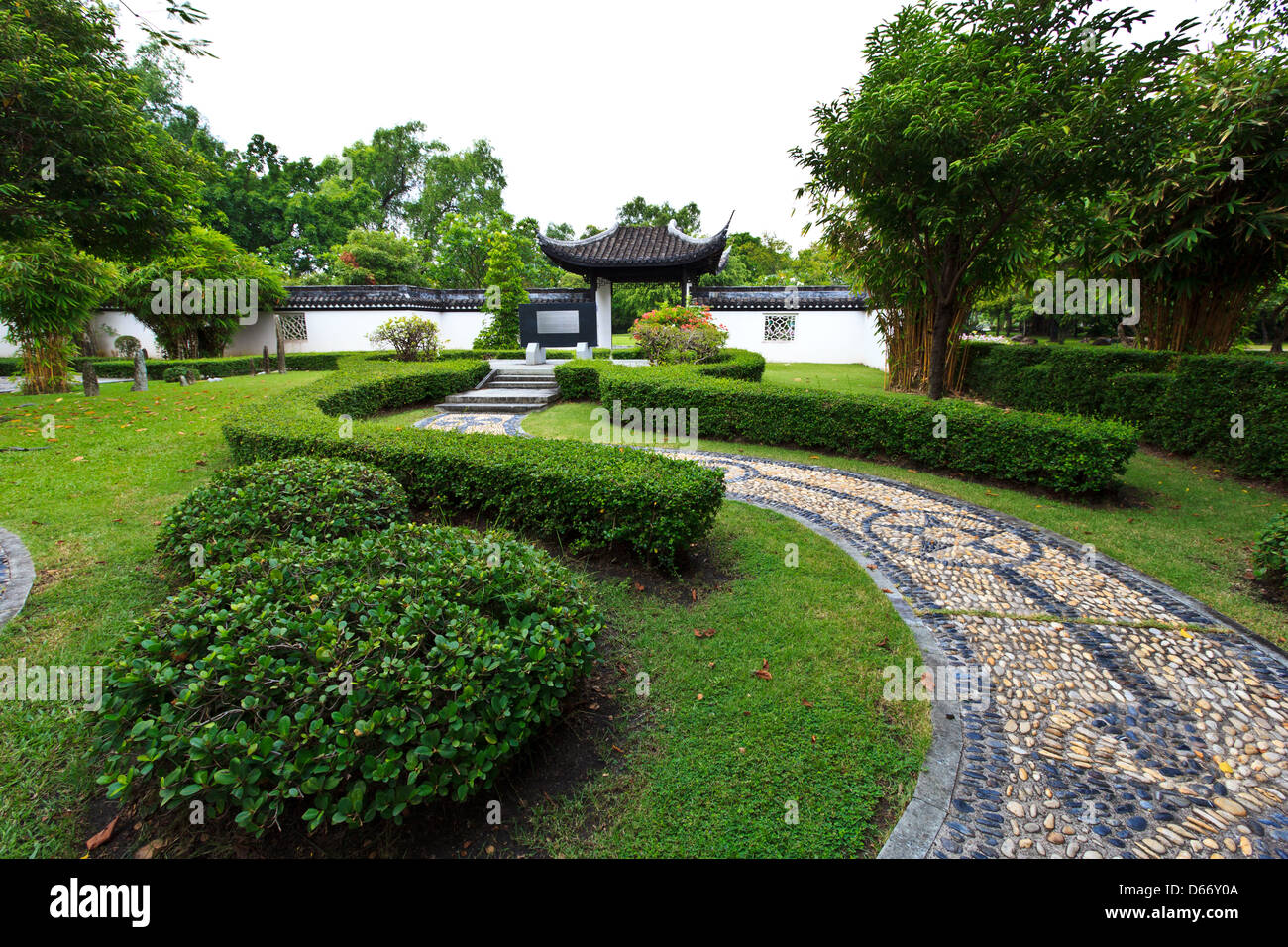 Chinese garden with circle rock path Stock Photo - Alamy