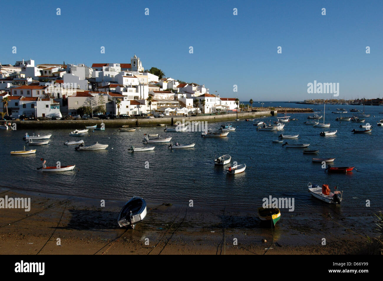 The centre of Ferragudo, seen from across the Arade River located at ...